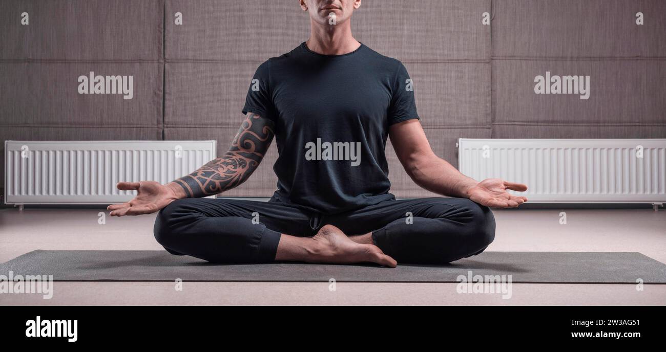 Adult man performs asana exercises. Yoga concept. Sports and healthy ...