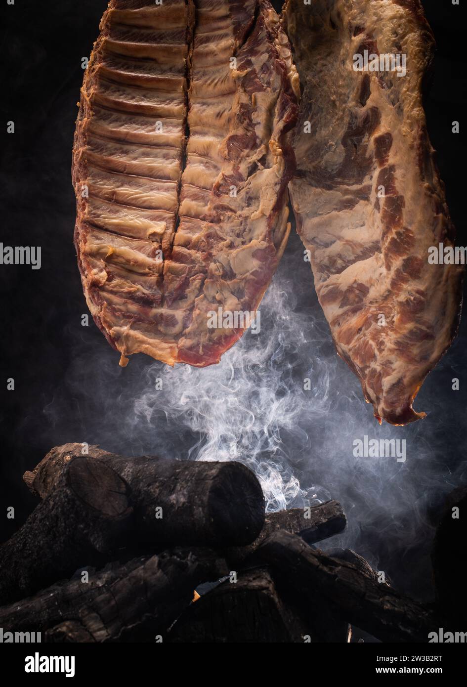 Drying pork meat in smokehouse,ribs Stock Photo - Alamy