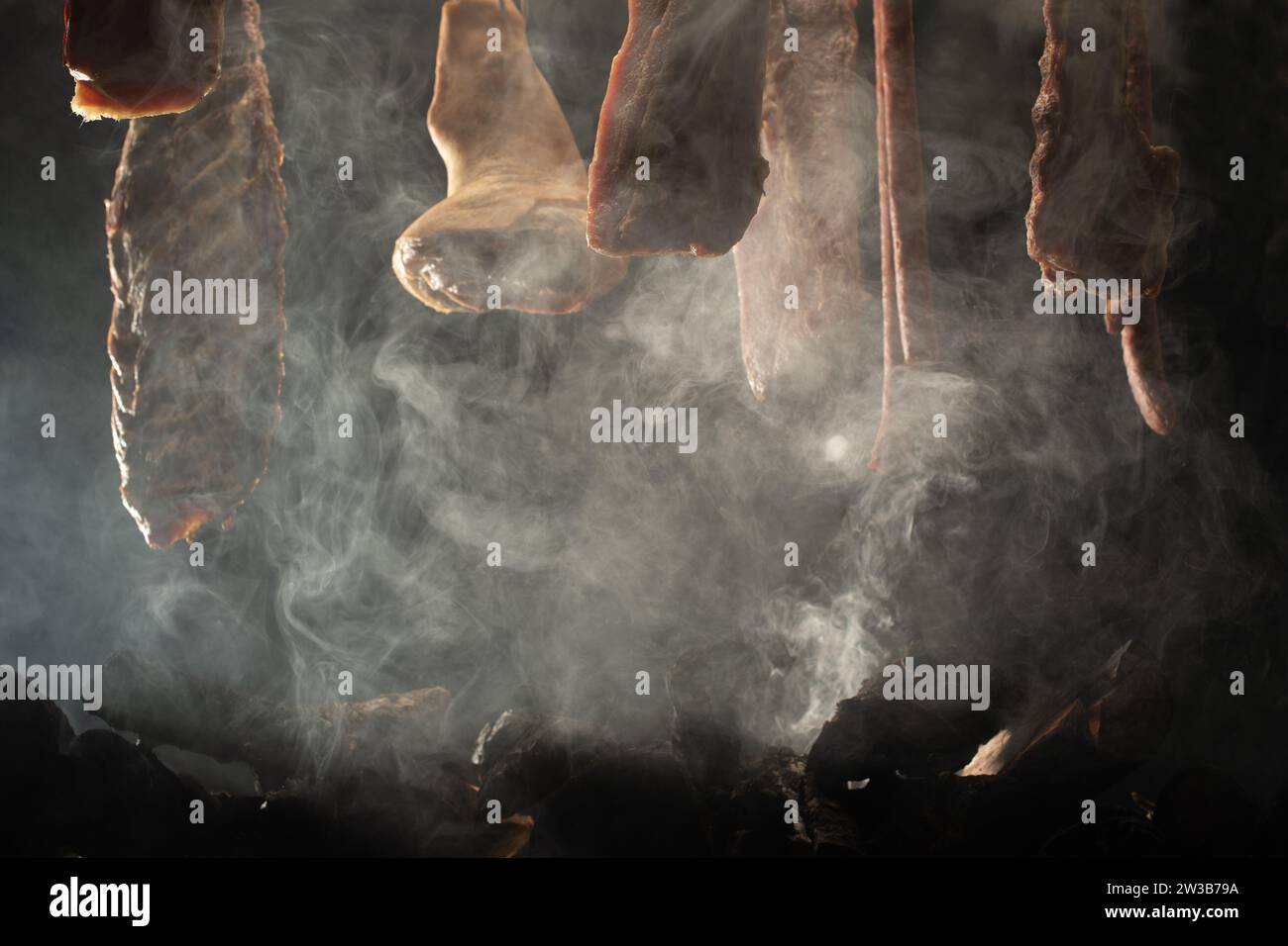 Drying pork meat in smokehouse,ribs,steak, knuckle, dried sausage Stock ...