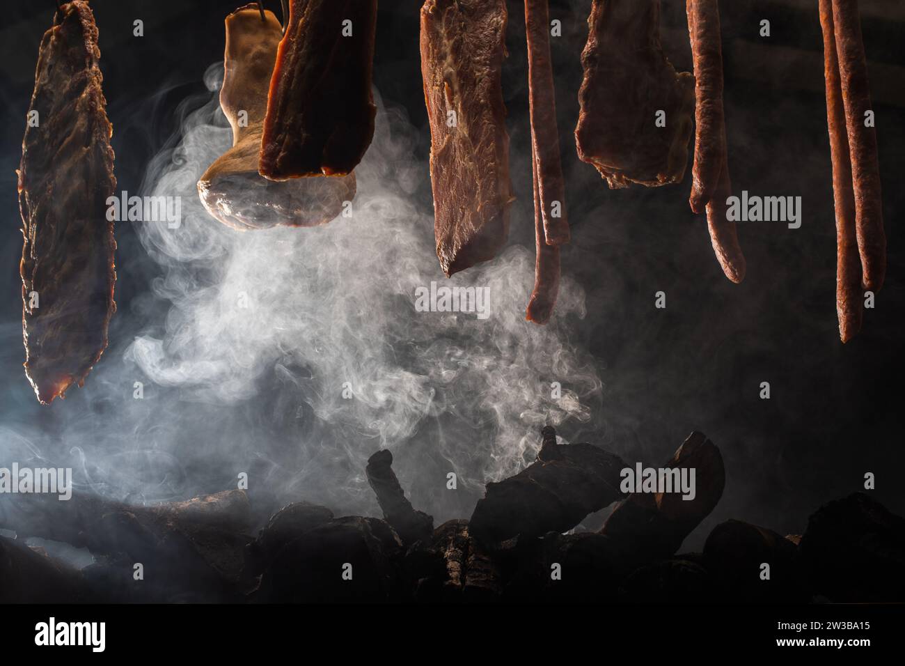 Drying pork meat in smokehouse,ribs,steak, knuckle, dried sausage Stock ...