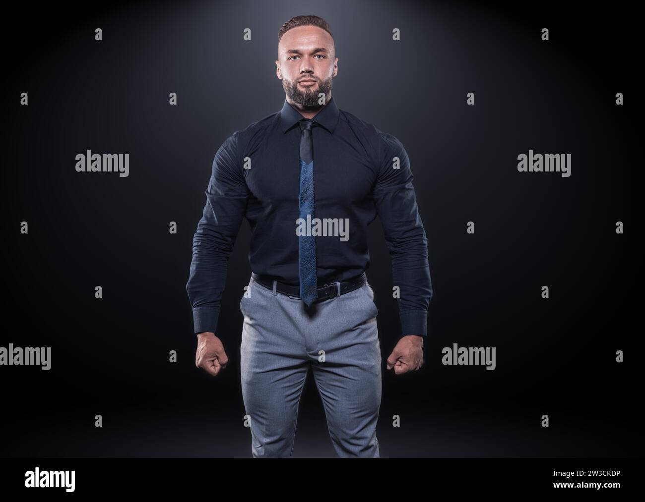 Image of a stylish powerful man in a black shirt and tie. Business and ...