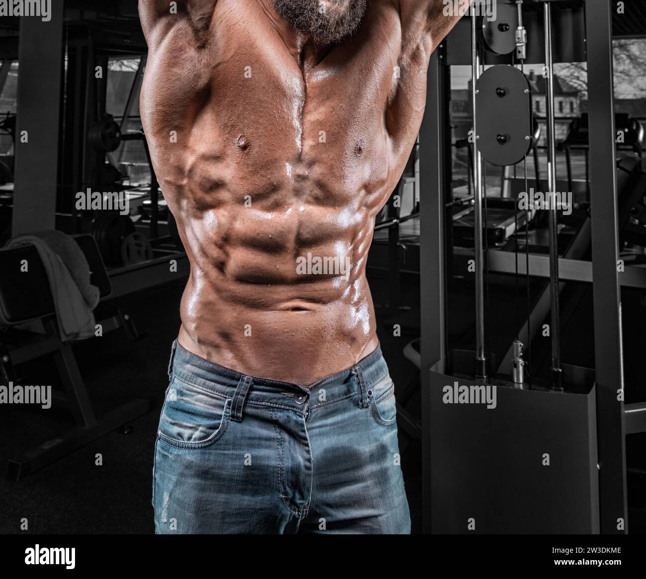 Professional athlete trains with elastic bands in the gym. Bodybuilding ...