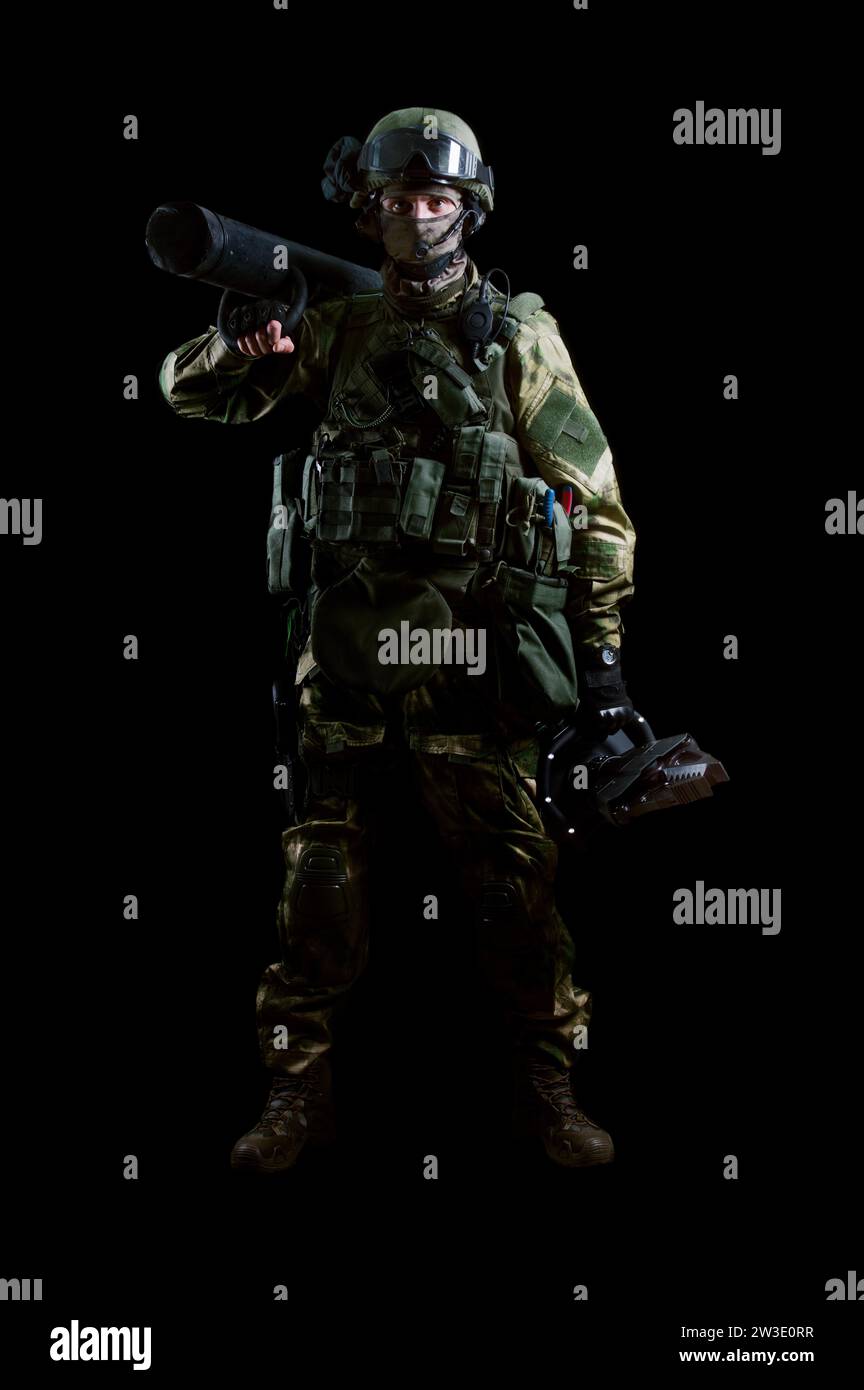 The soldier of the special unit stands in military uniform with a ram ...