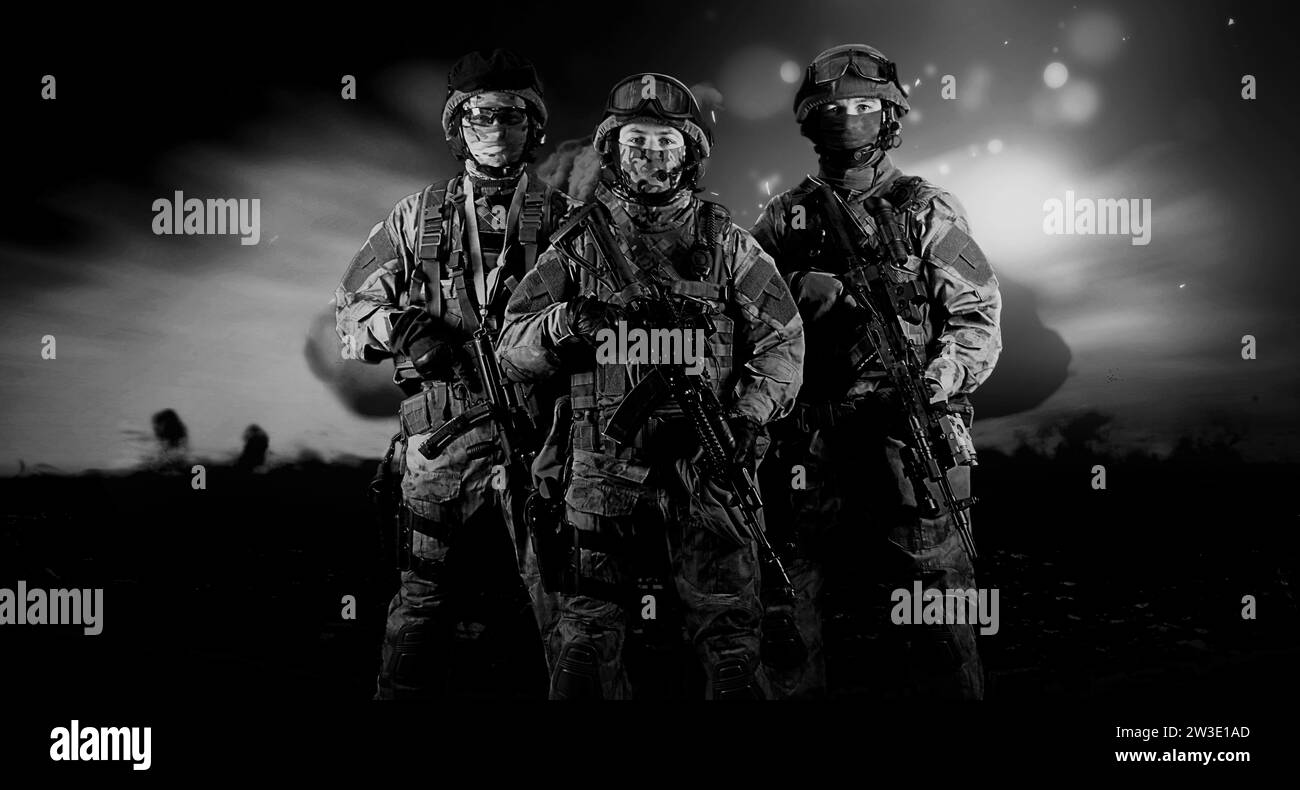 Three soldiers in uniform with a weapon in their hands are looking ...