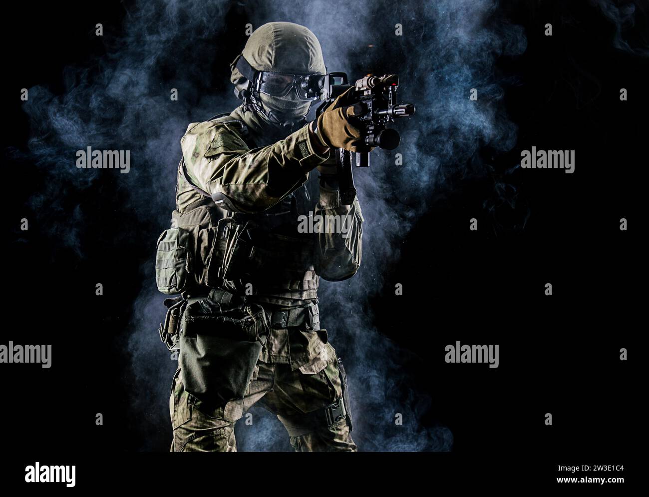 American soldier in combat ammunition with weapon in the hands of ...