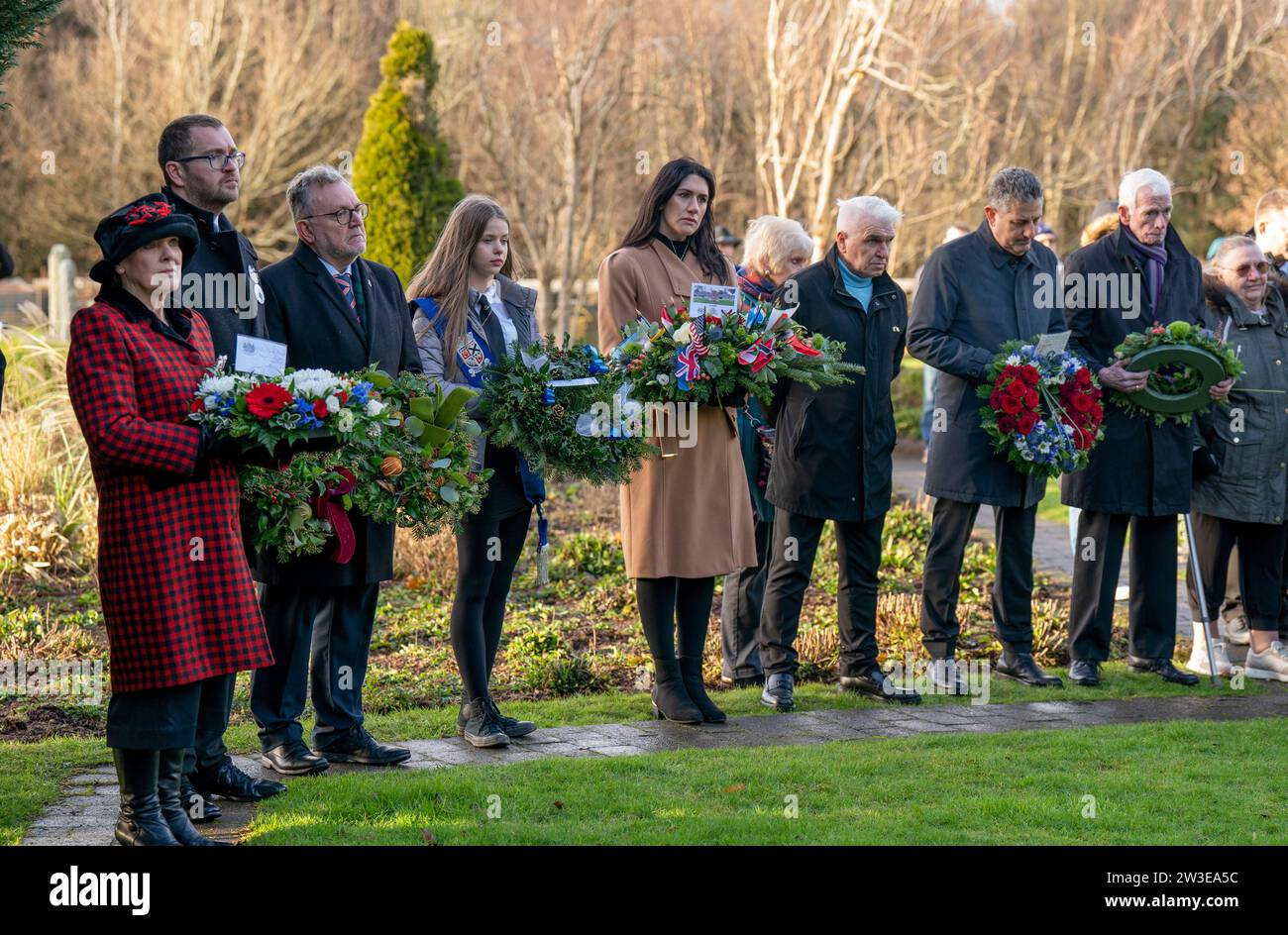 People gather to pay their respects at a wreath laying ceremony to mark ...