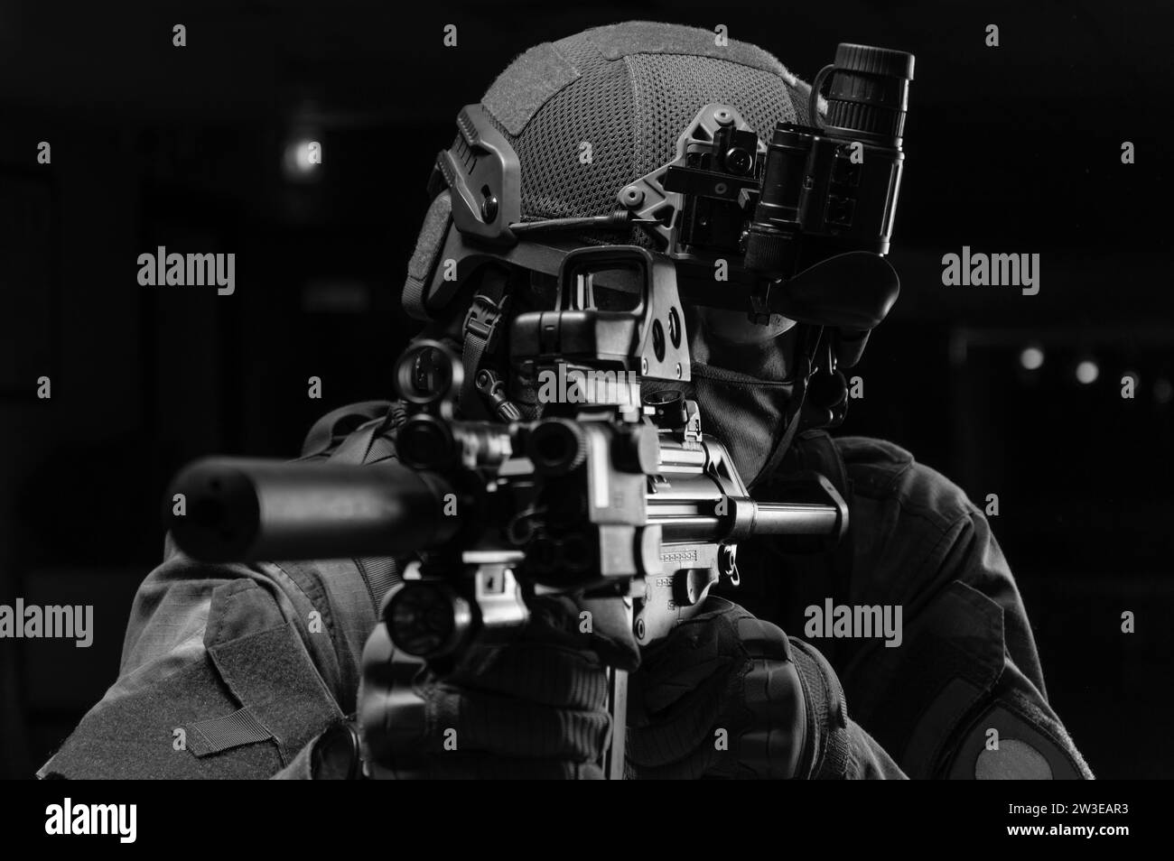 The soldier of the special unit aims at the collimator sight of his ...