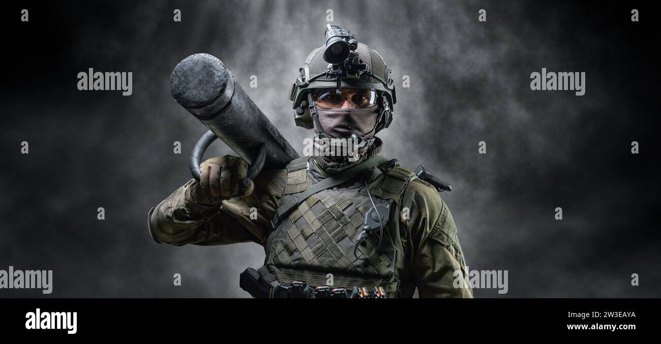 Portrait of a Special Forces soldier with an assault ram on his ...