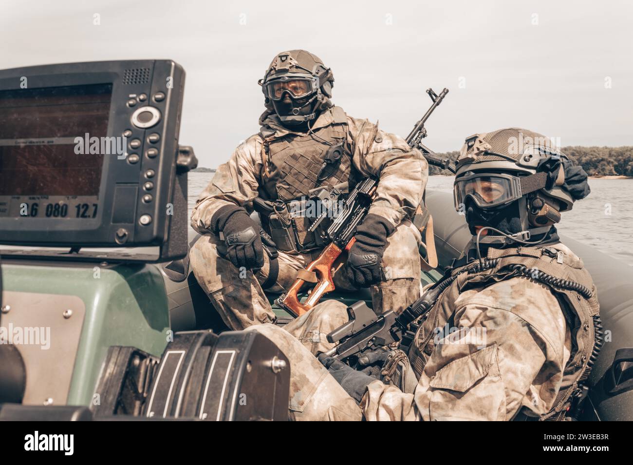 Group of military fighters on a boat with a flasher are chasing pirates ...