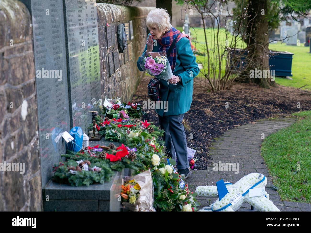 People gather to pay their respects at a wreath laying ceremony to mark ...
