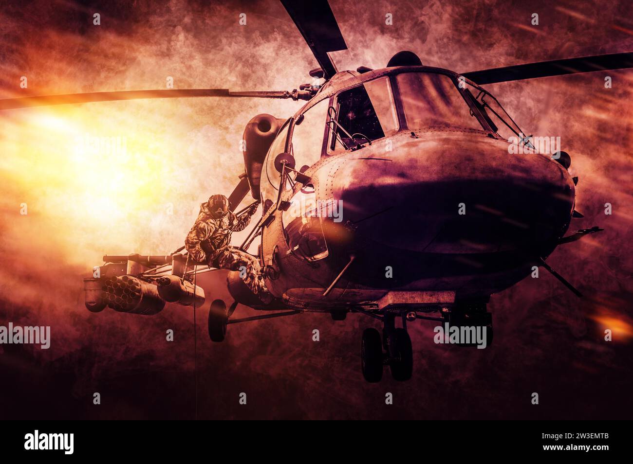 Image of a military man attached with a rope to a helicopter ...