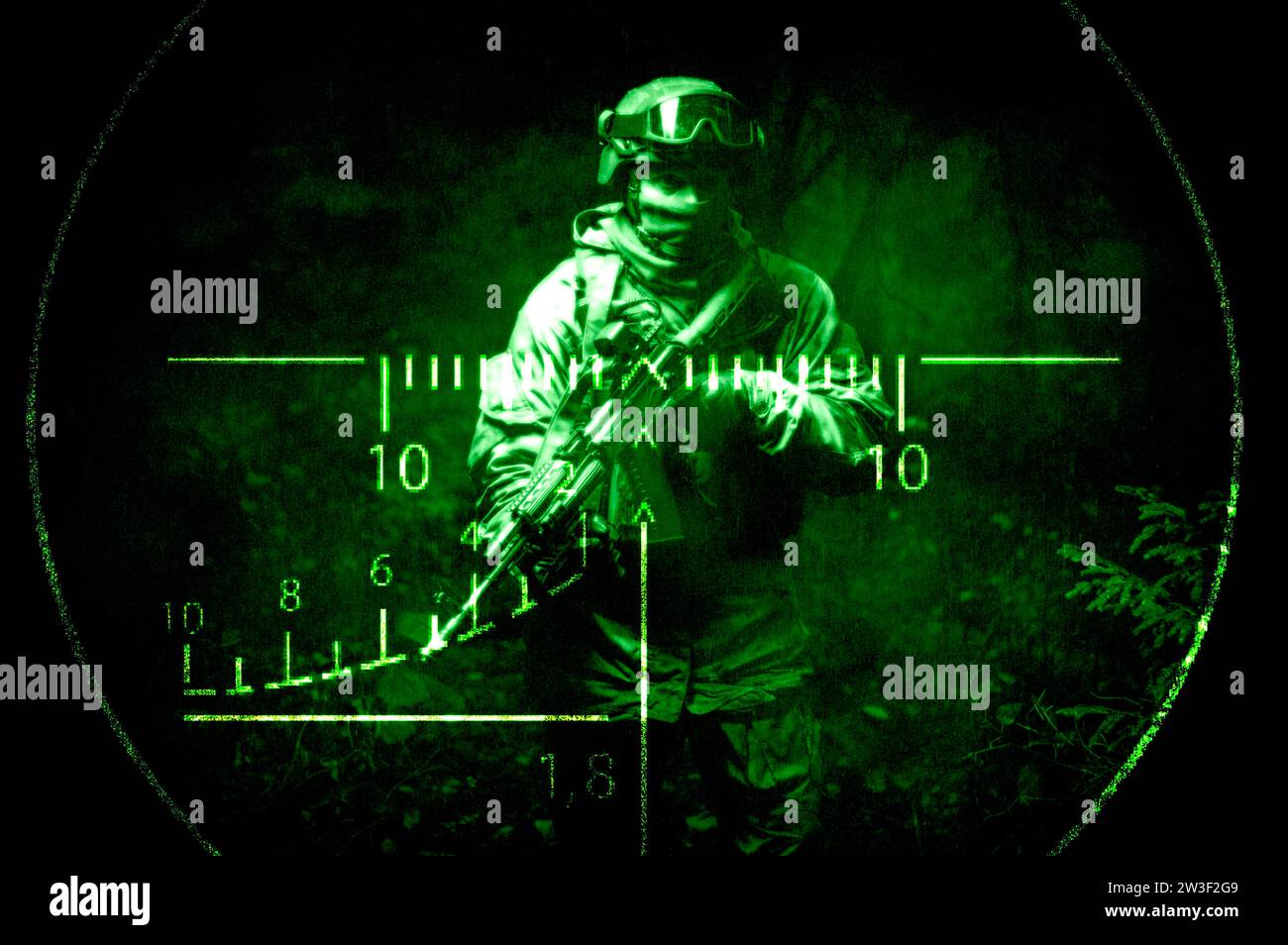 Portrait of a commando in the night sight of a sniper rifle. The ...