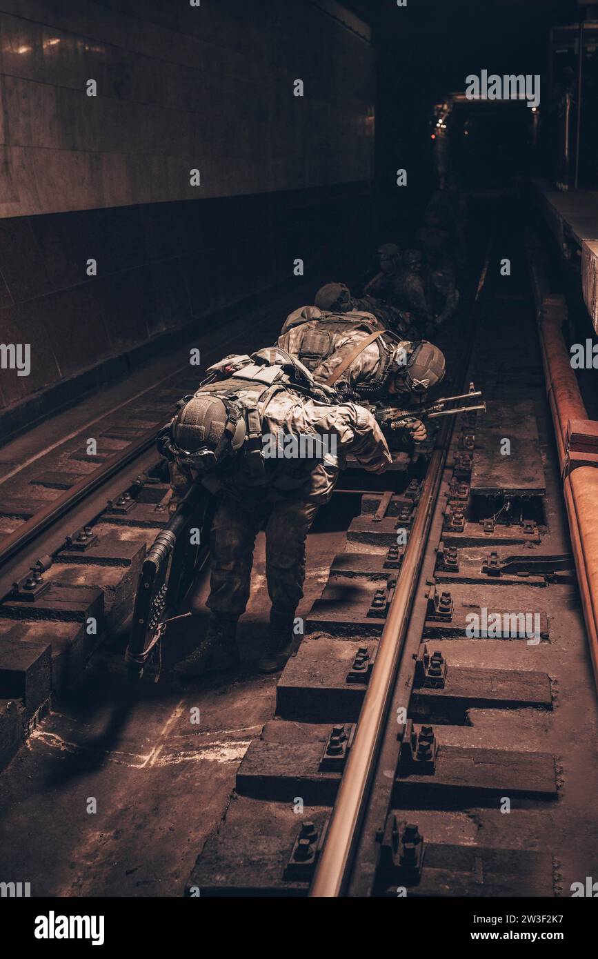 Image of a SWAT group sneaking along the rails in the subway. Special ...