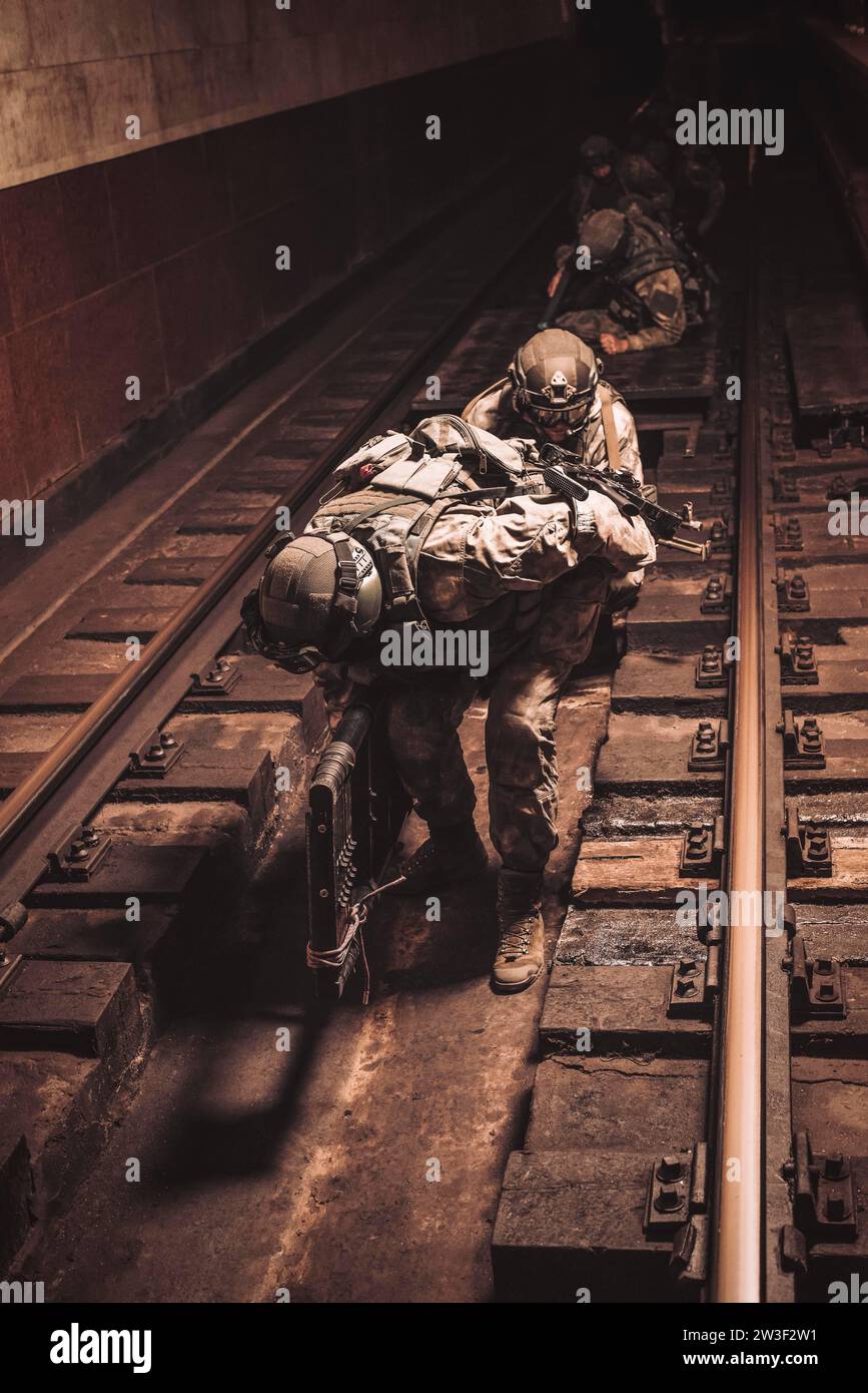 Image of a SWAT group sneaking along the rails in the subway. Special ...