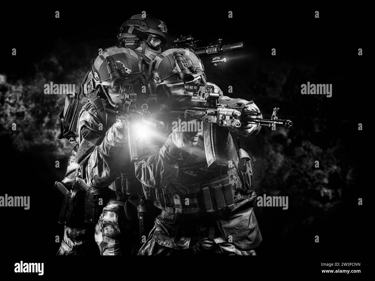 American soldiers in combat ammunition with weapons in the hands of ...