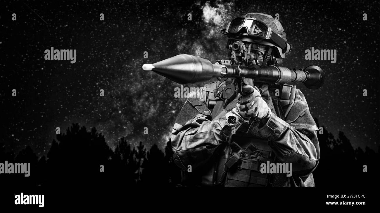 American soldier aims at the sight of an RPG against the background of ...