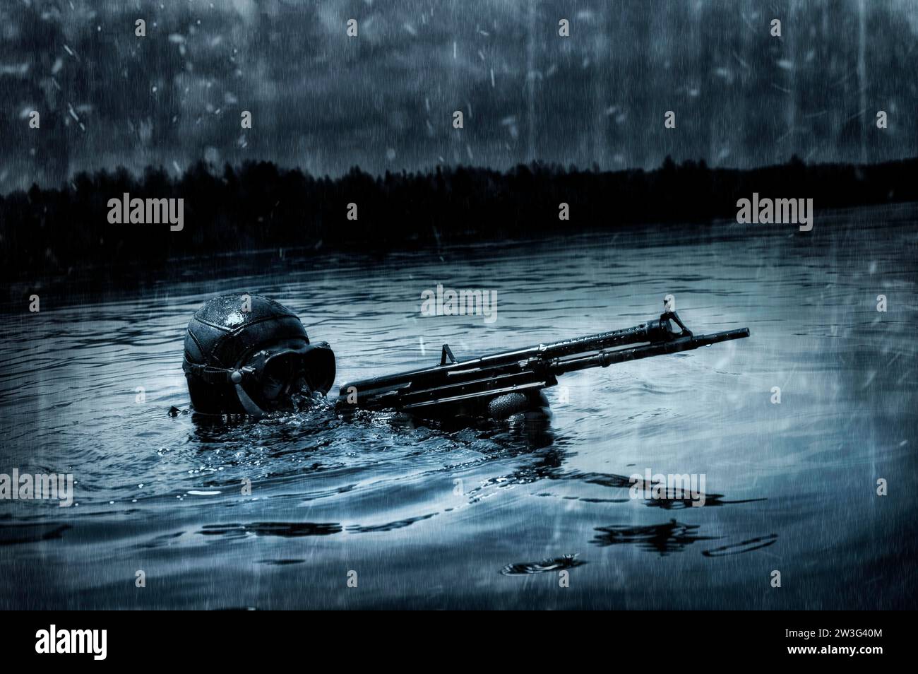 Military diver emerges from under the water and takes aim from the ...