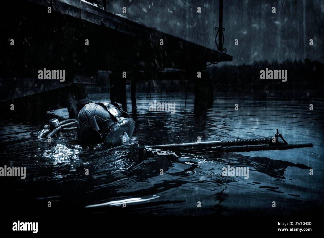 Military diver emerges from under the water and takes aim from the ...