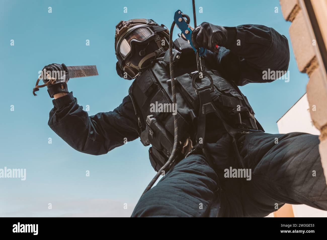 Special forces soldier storms the building through the window. Training ...