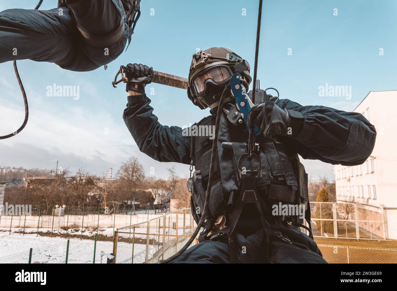 Special forces soldier storms the building through the window. Training ...