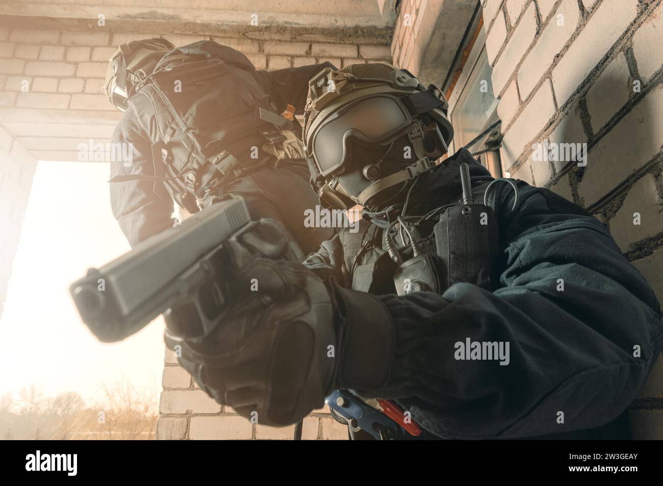 Group of special forces fighters storm the building through the window ...