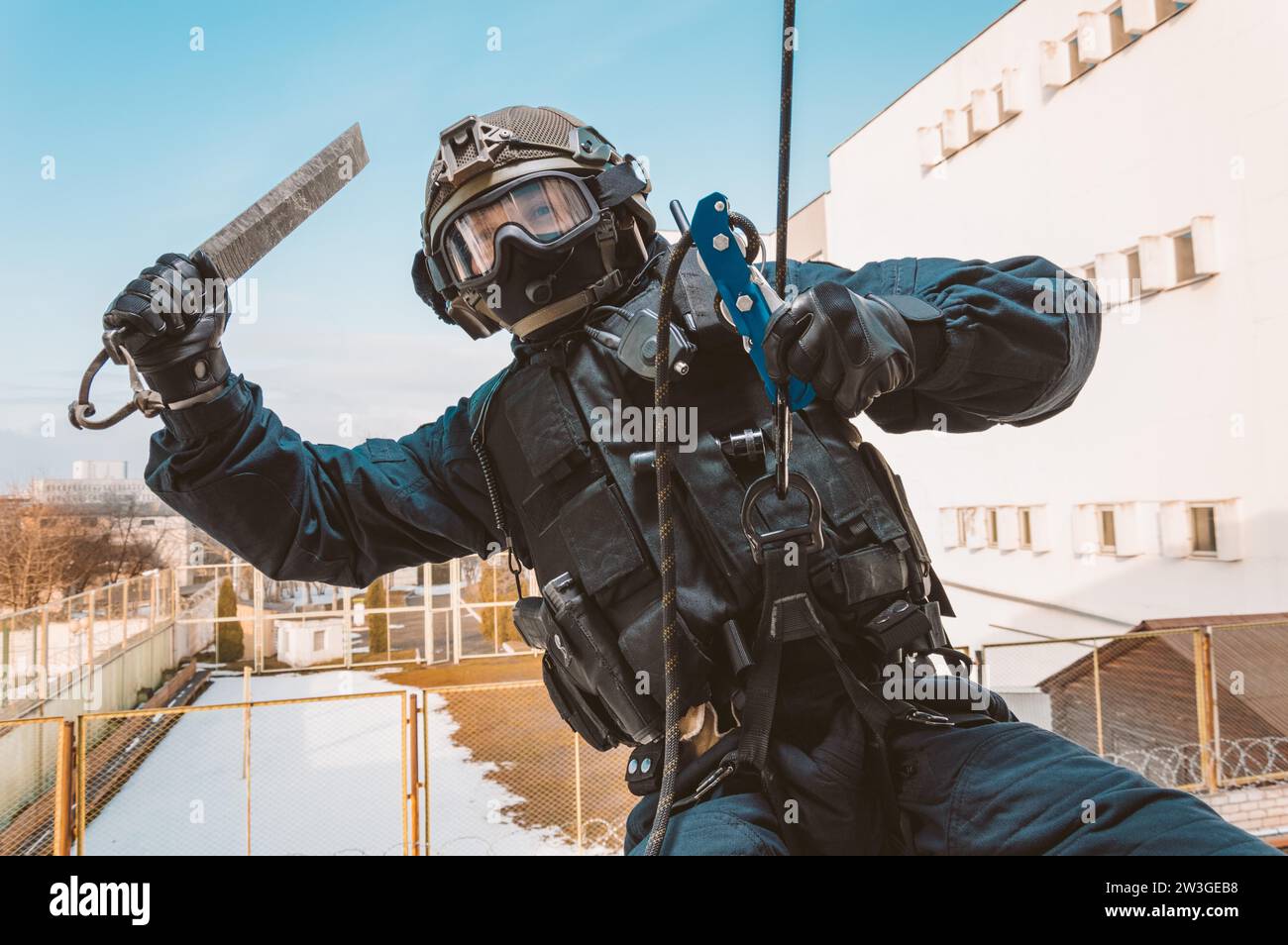 Special forces soldier storms the building through the window. Training ...