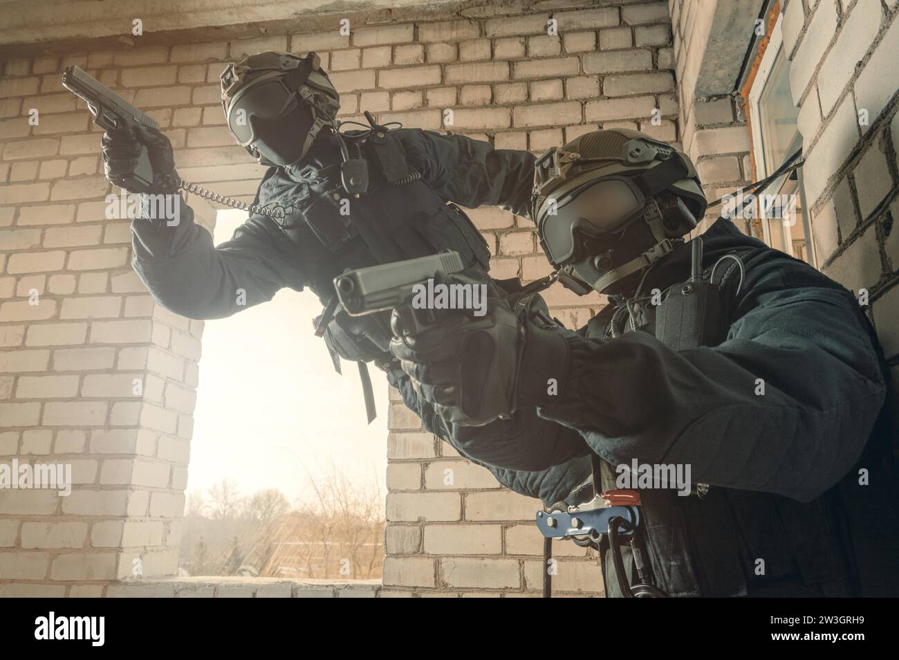 Group of special forces fighters storm the building through the window ...