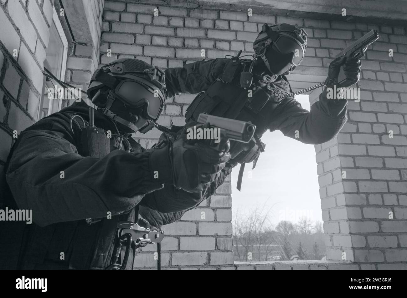 Group of special forces fighters storm the building through the window ...