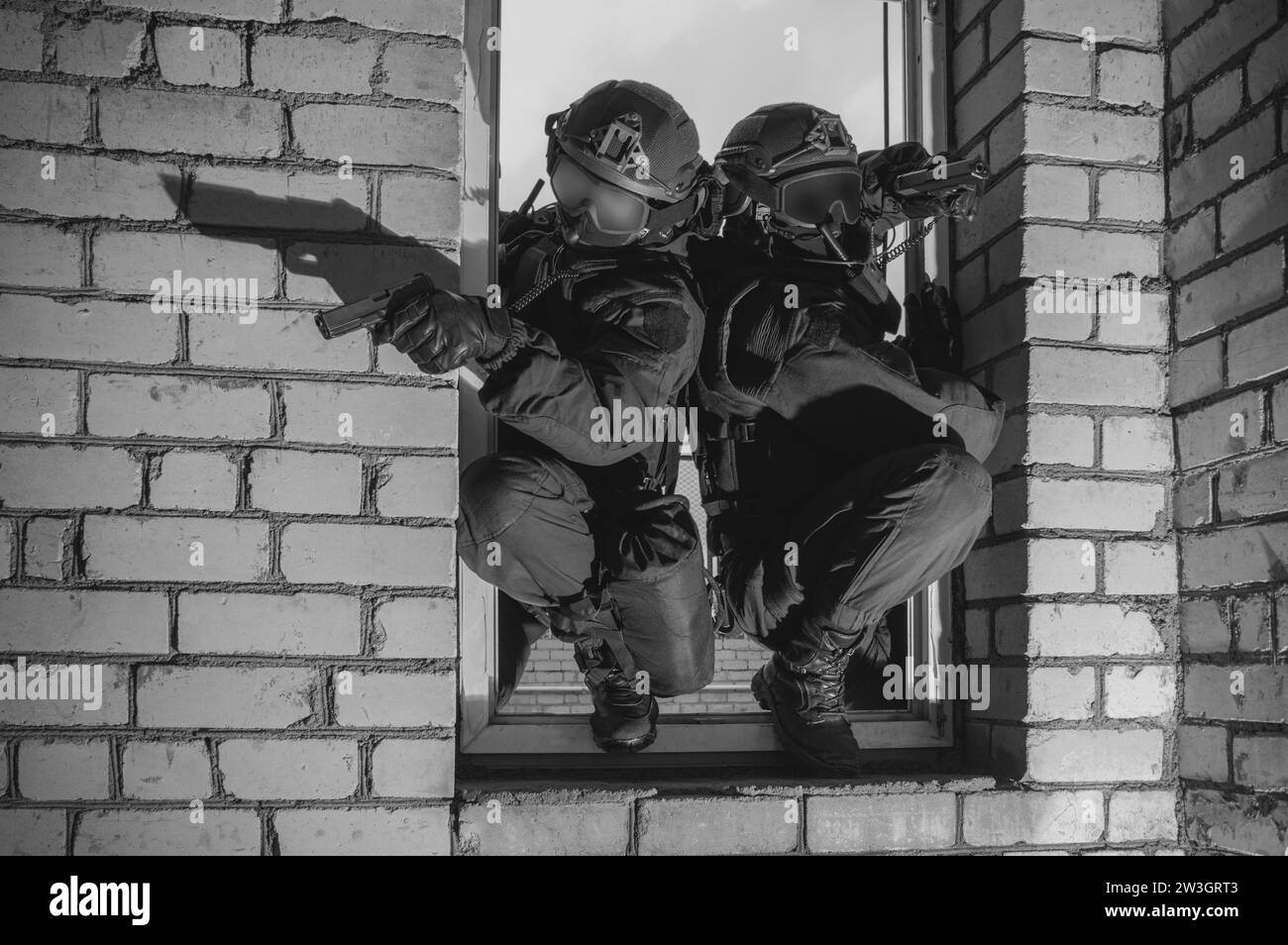 Group of special forces fighters storm the building through the window ...