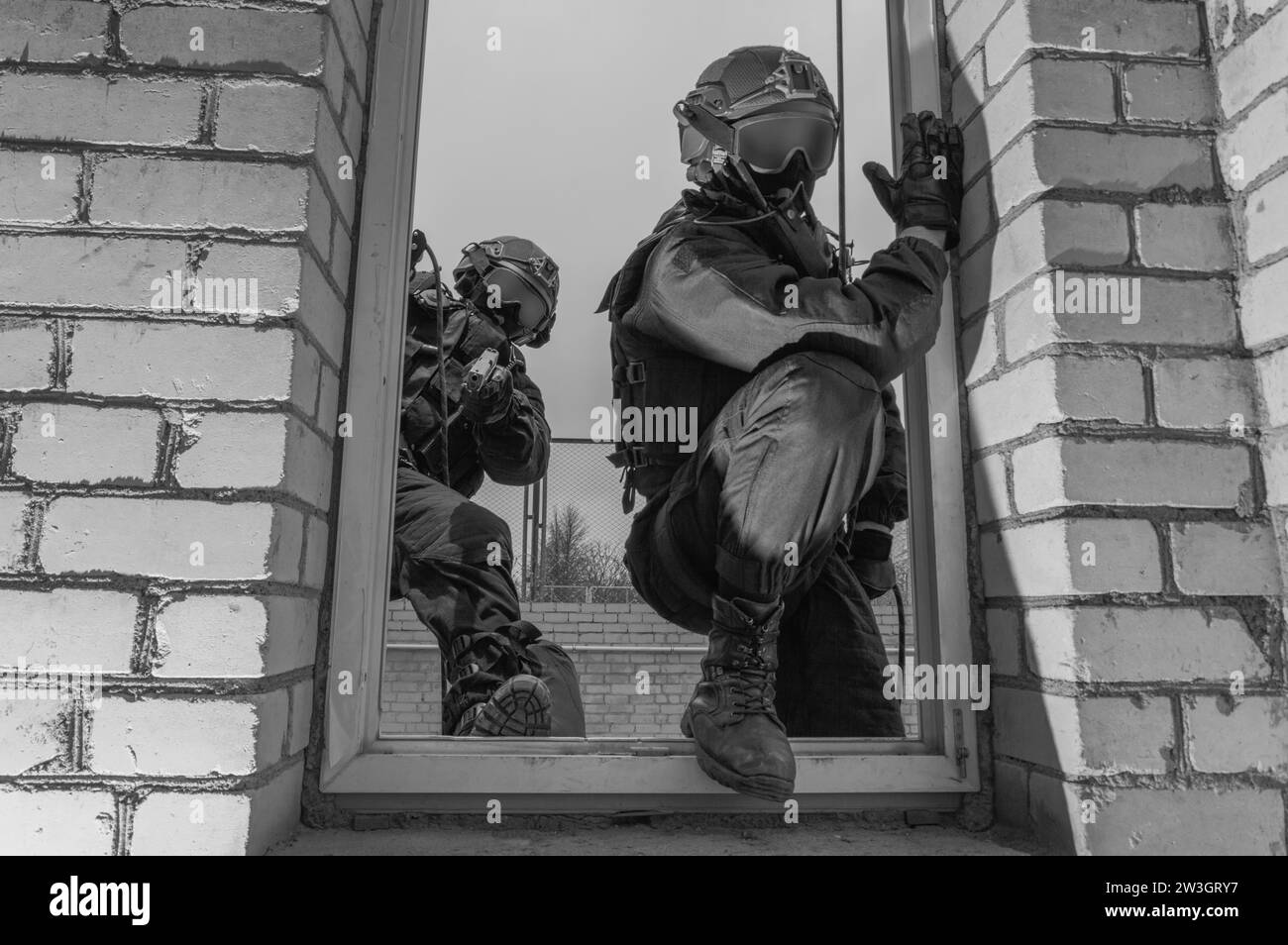 Group of special forces fighters storm the building through the window ...