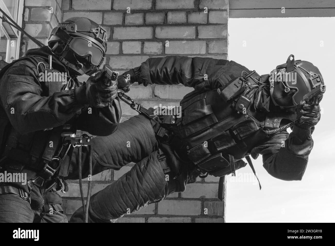 Group of special forces fighters storm the building through the window ...