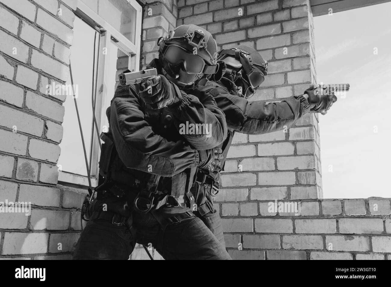Group of special forces fighters storm the building through the window ...