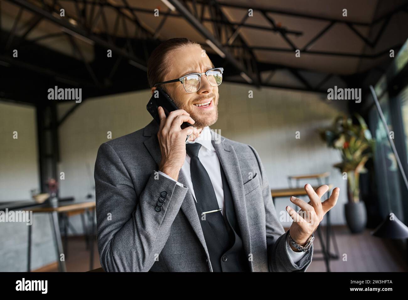 confused good looking businessman with glasses in smart suit talking ...