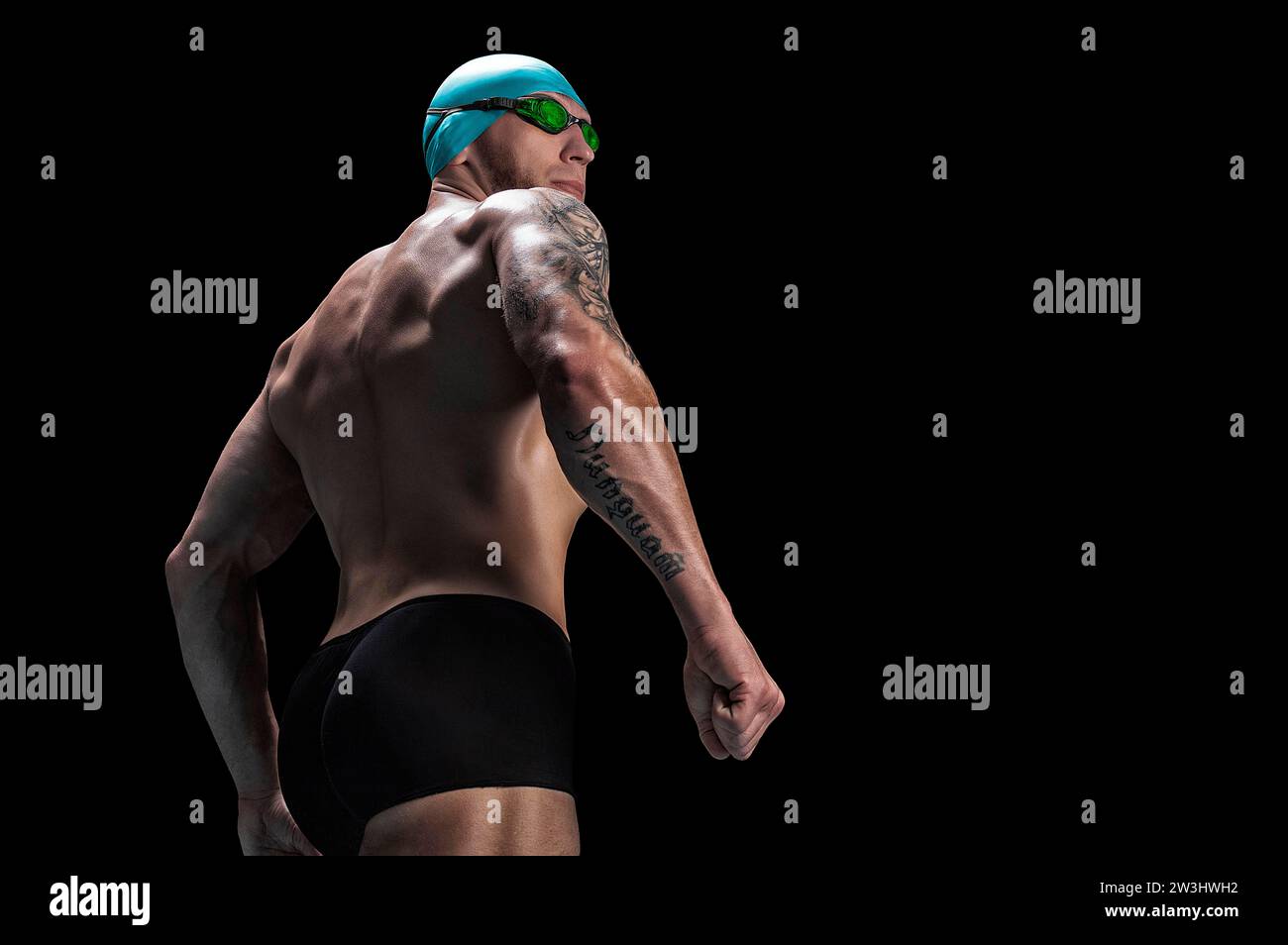 Portrait of a swimmer on a black background. The concept of swimming ...