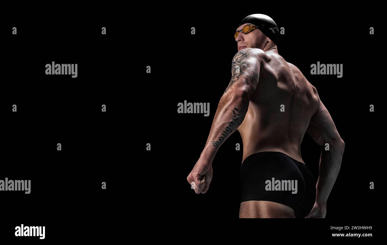 Portrait of a swimmer on a black background. The concept of swimming ...