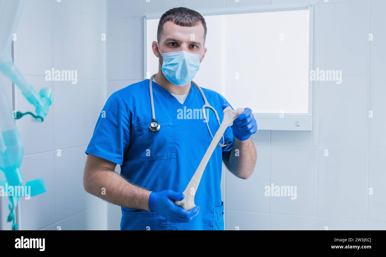Portrait of a male doctor against the background of a negatoscope with ...
