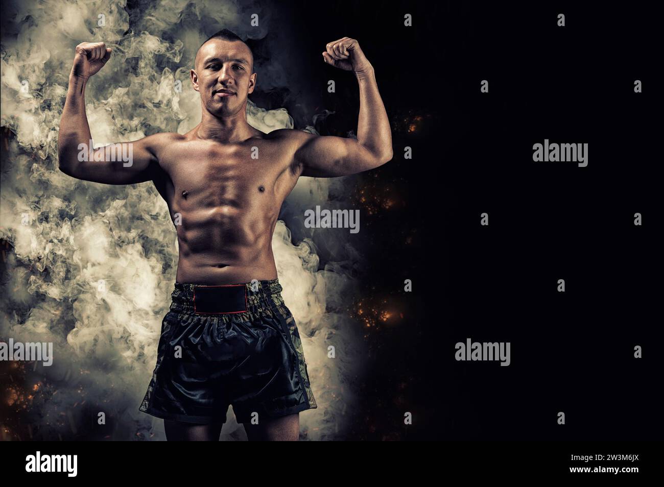 Portrait of a boxer of mixed martial arts standing against the backdrop ...