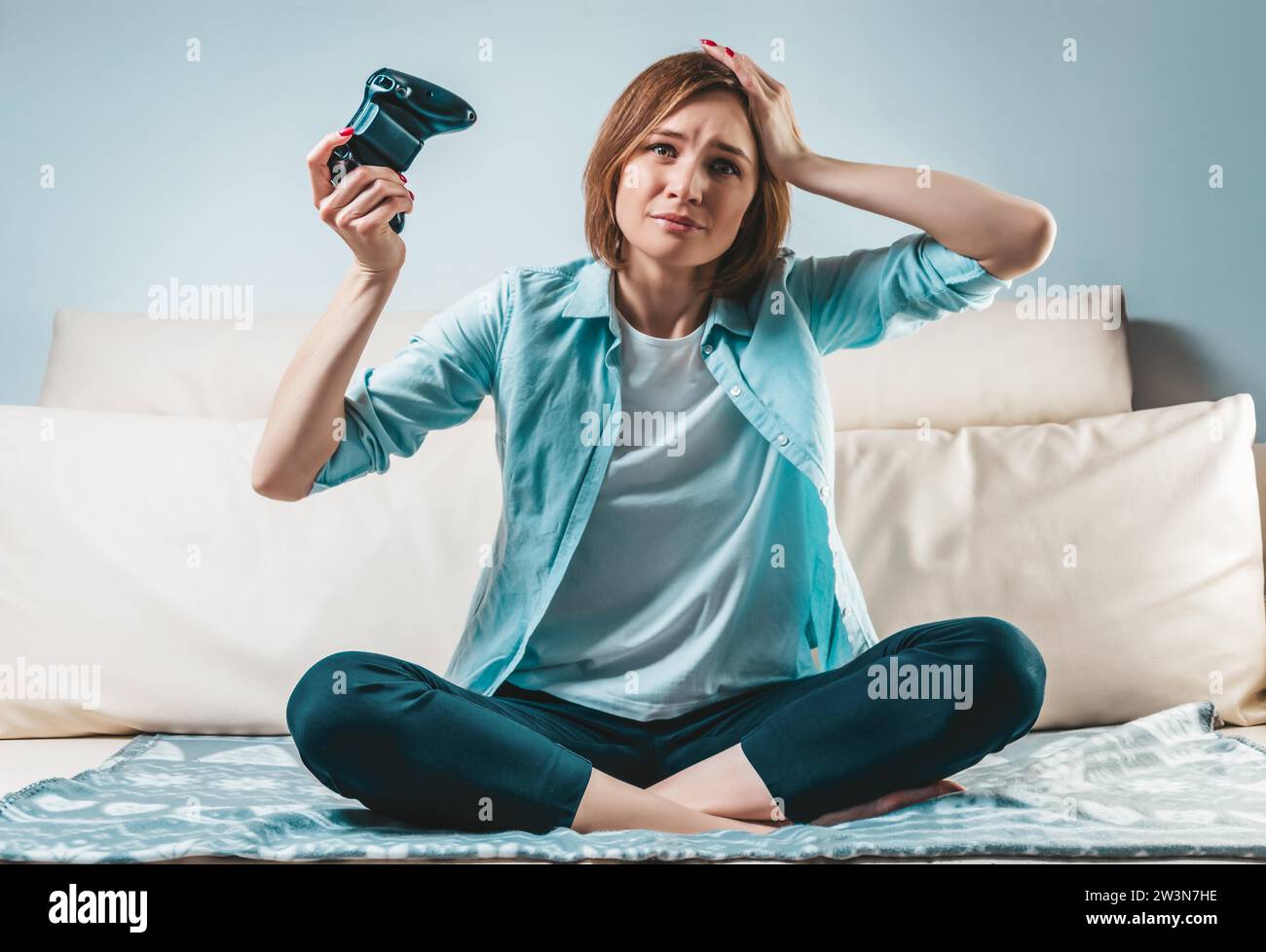 Portrait of a girl with a joystick in her hands. The concept of video ...