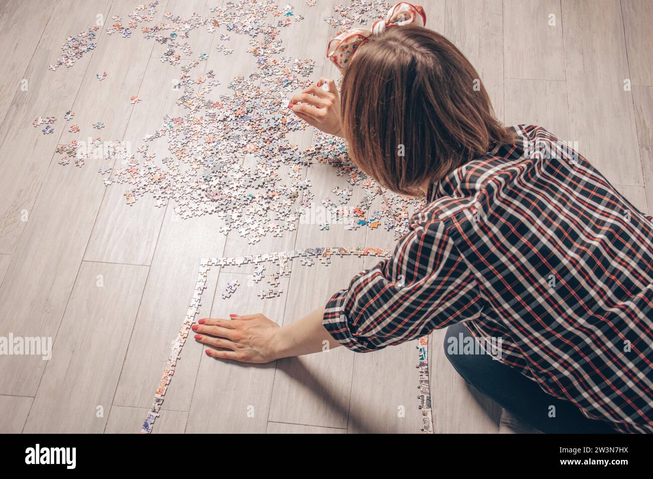 Teenager plays puzzles. The concept of board educational games. Stay at ...