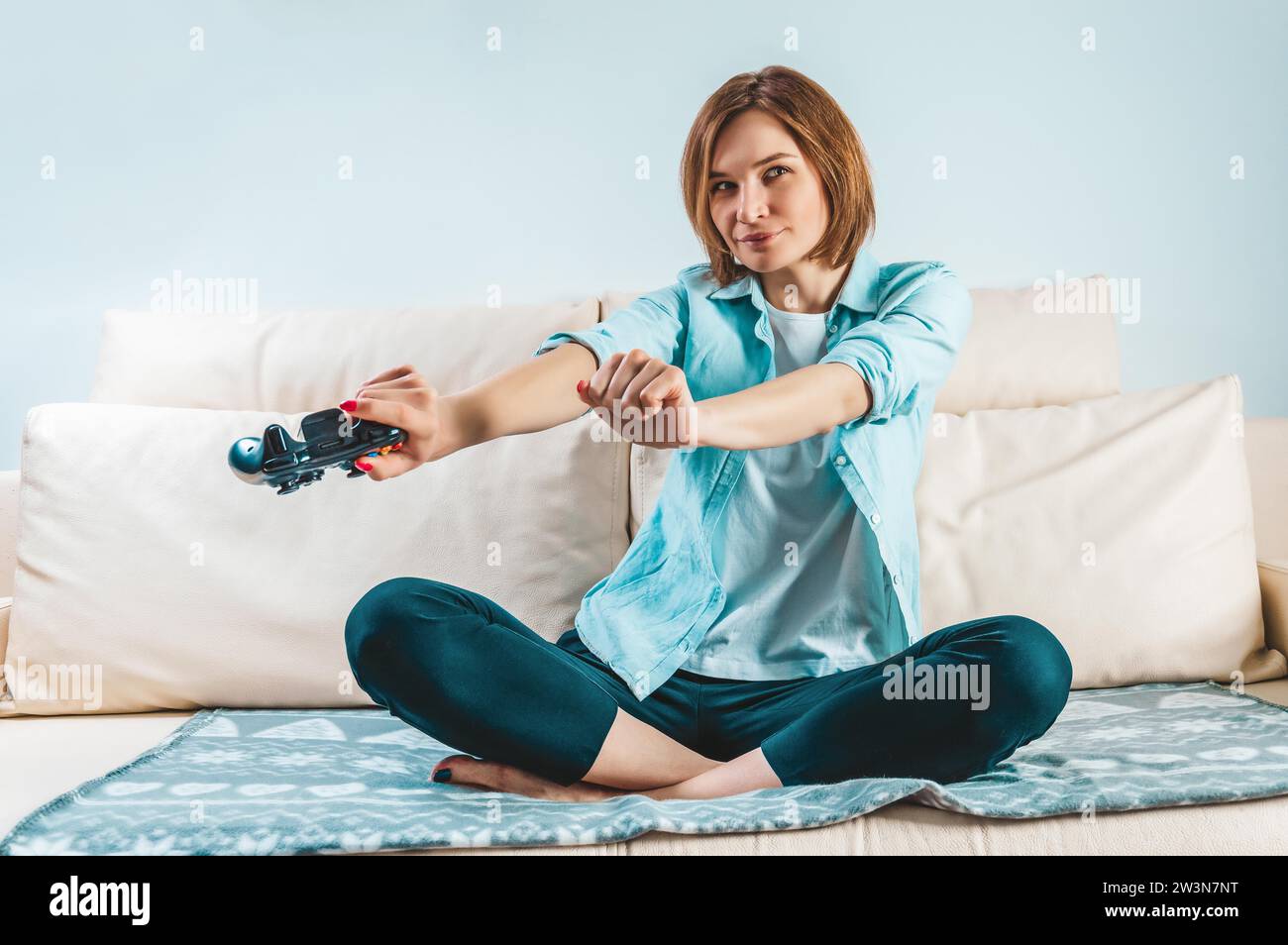 Portrait of a girl with a joystick in her hands. The concept of video ...