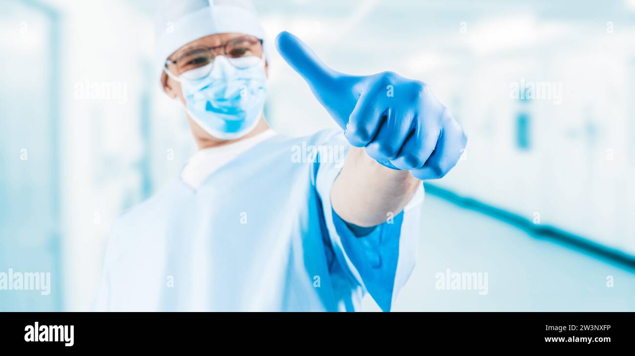 The doctor in the medical center shows a raised finger. Medicine ...