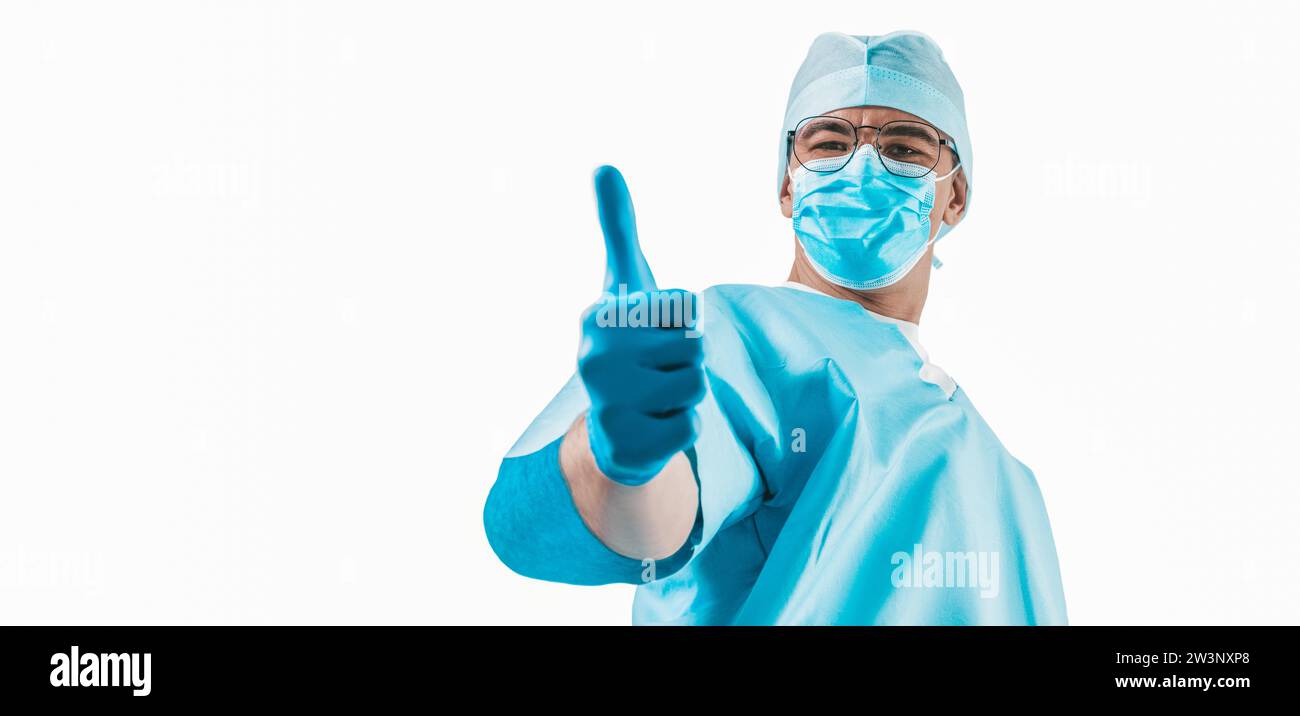 The doctor shows a raised finger up on a white background. Medicine ...