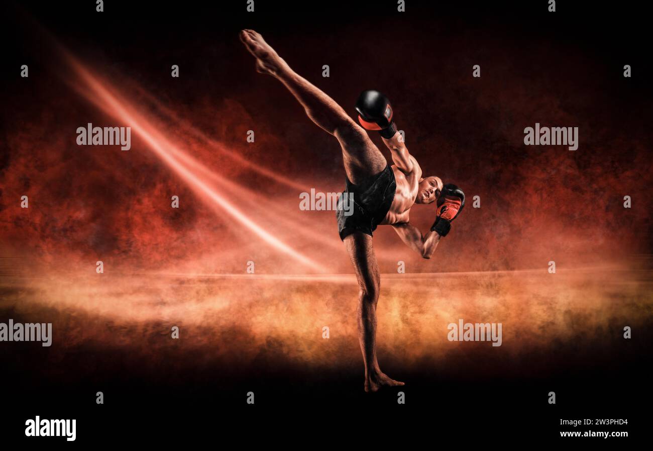 Image of a kickboxer in a fiery arena. Knee kick. Mixed martial arts ...
