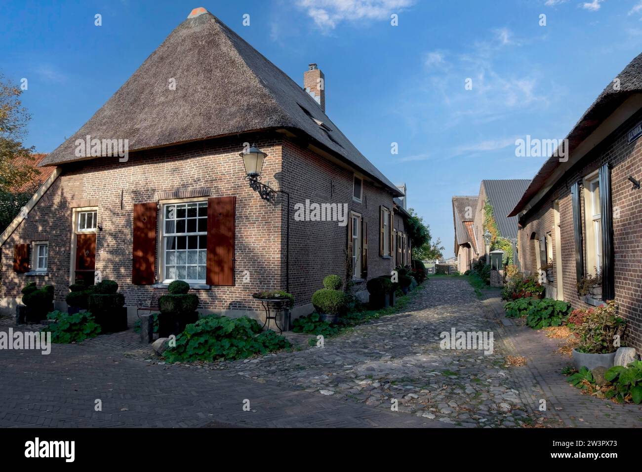 Street with brick houses and cobblestones in the small town of ...