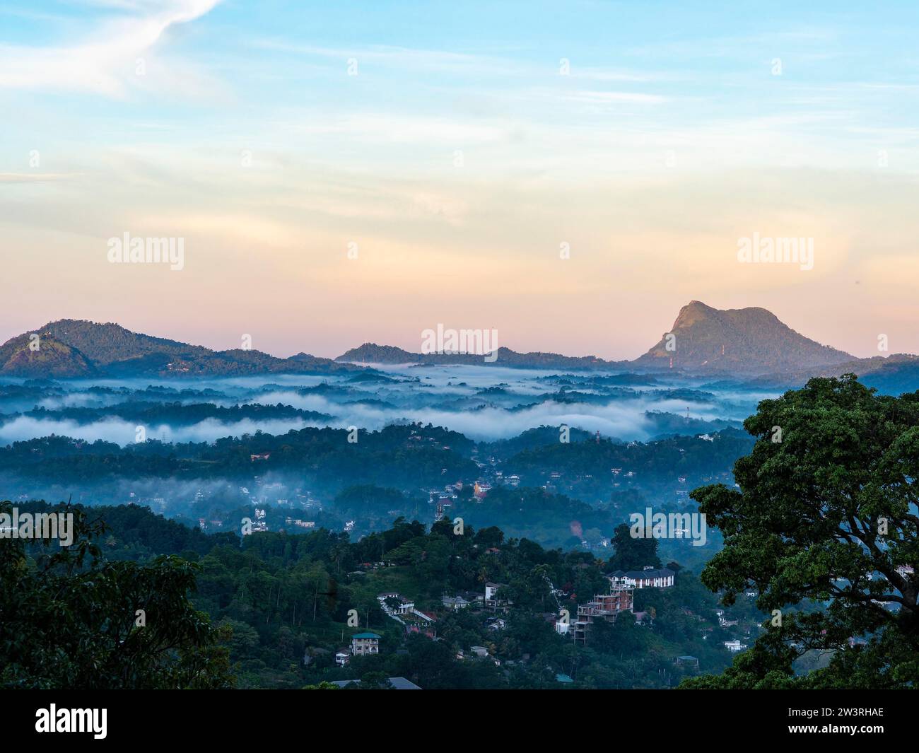Mountain landscape with morning mist over forests near Kandy, Sri Lanka ...