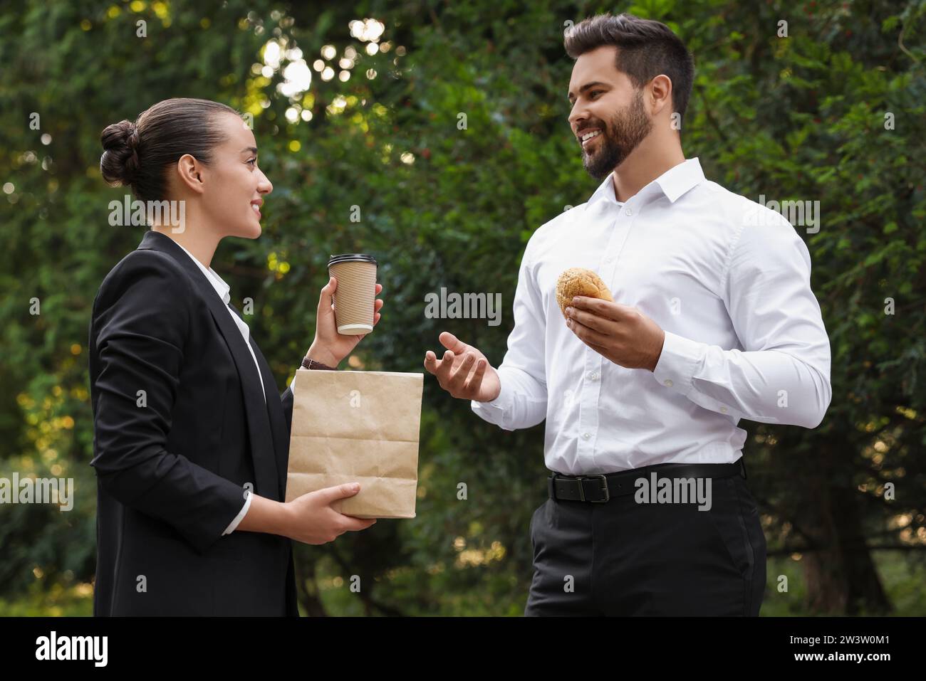Business lunch. Happy colleagues spending time together during break ...