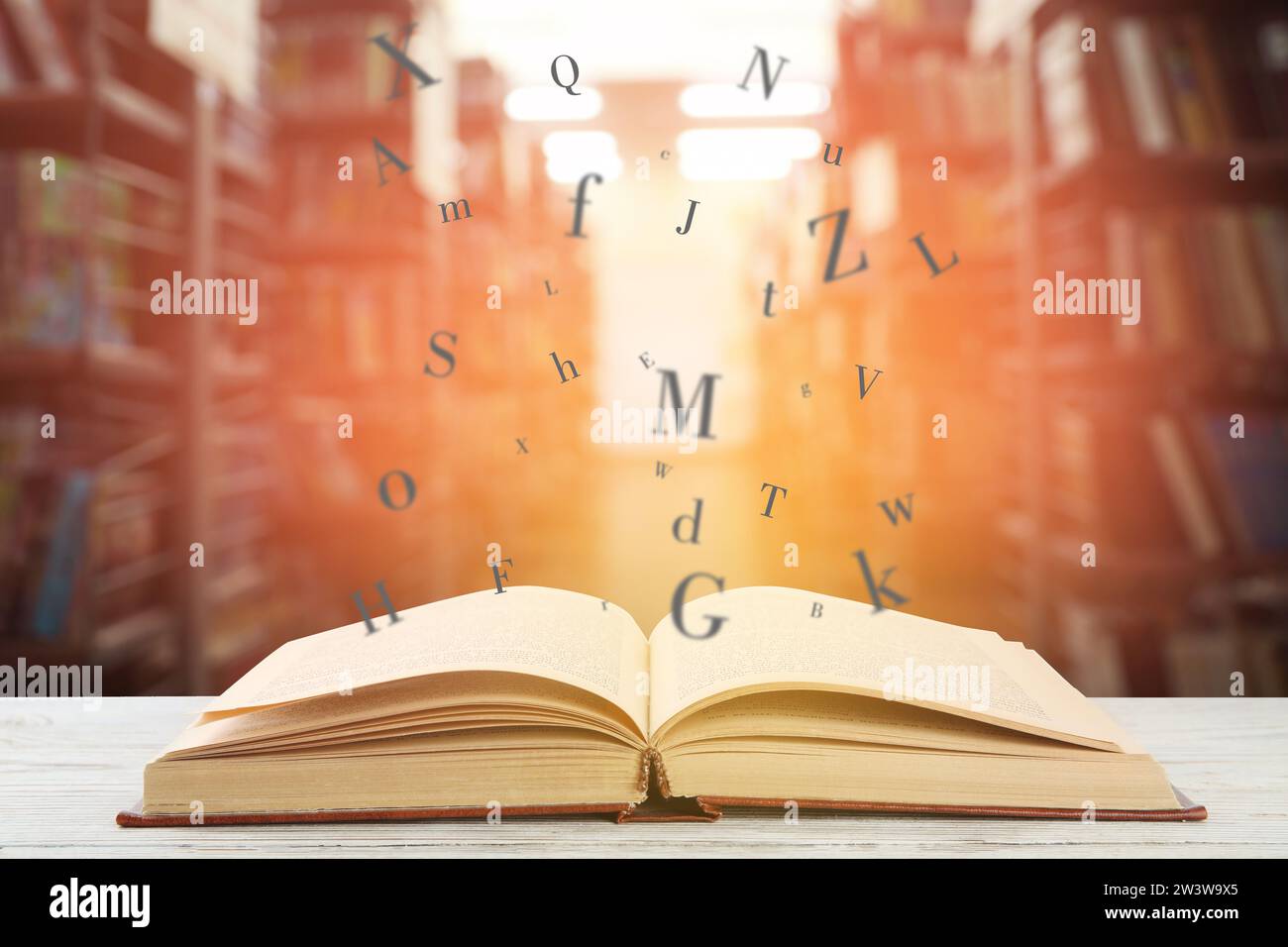 Open book flying alphabet hi-res stock photography and images - Alamy