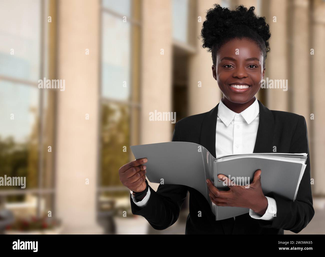 Lawyer, consultant, business owner. Confident woman with file folders ...