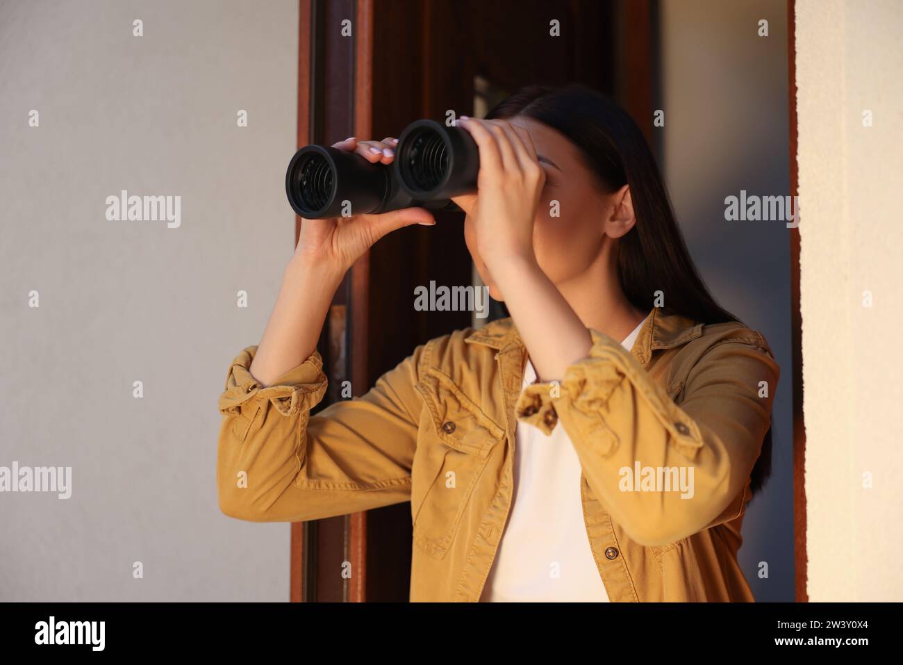 Spying on neighbours hi-res stock photography and images - Alamy