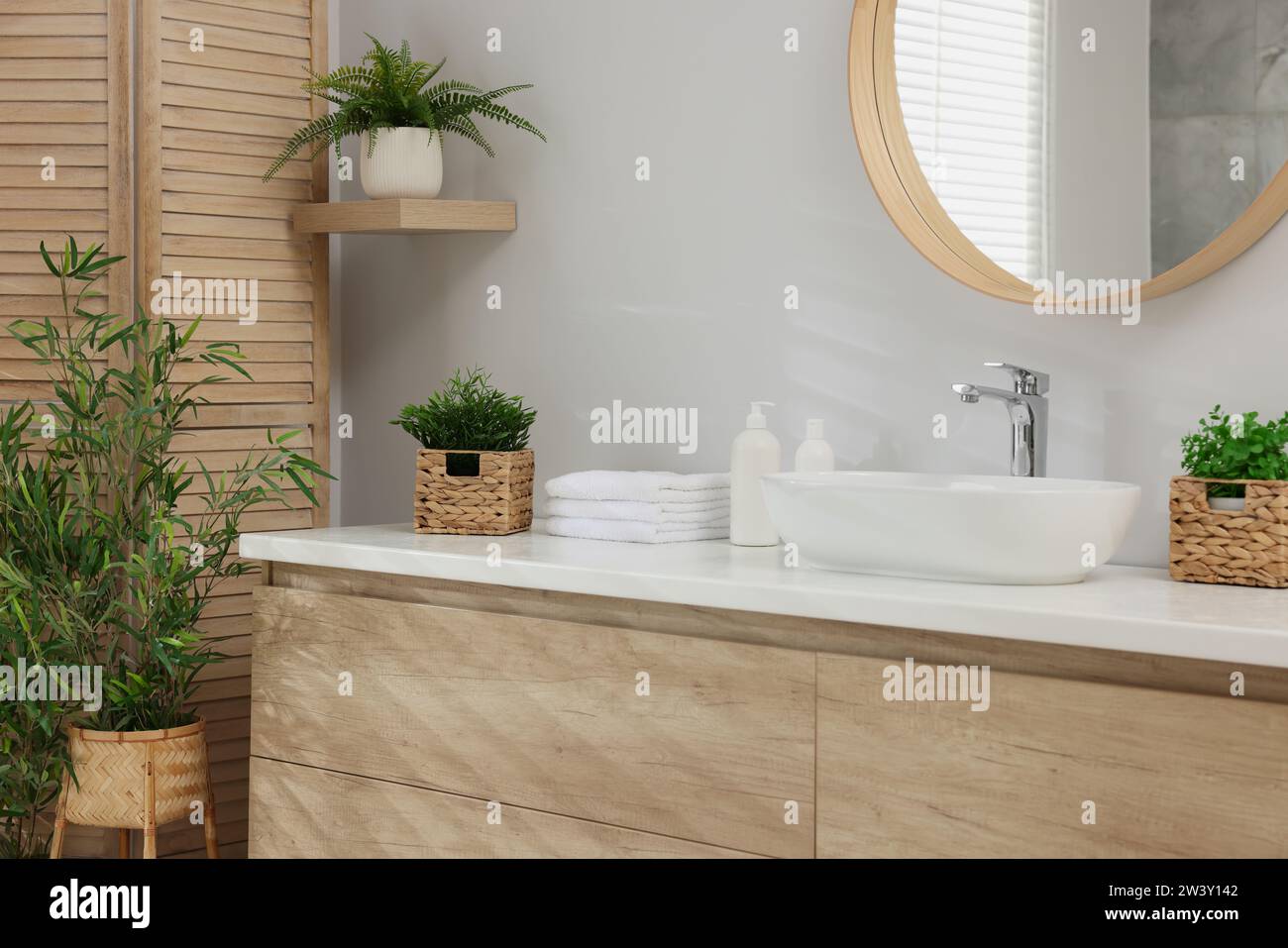 Different potted artificial plants in bathroom. Home decor Stock Photo ...